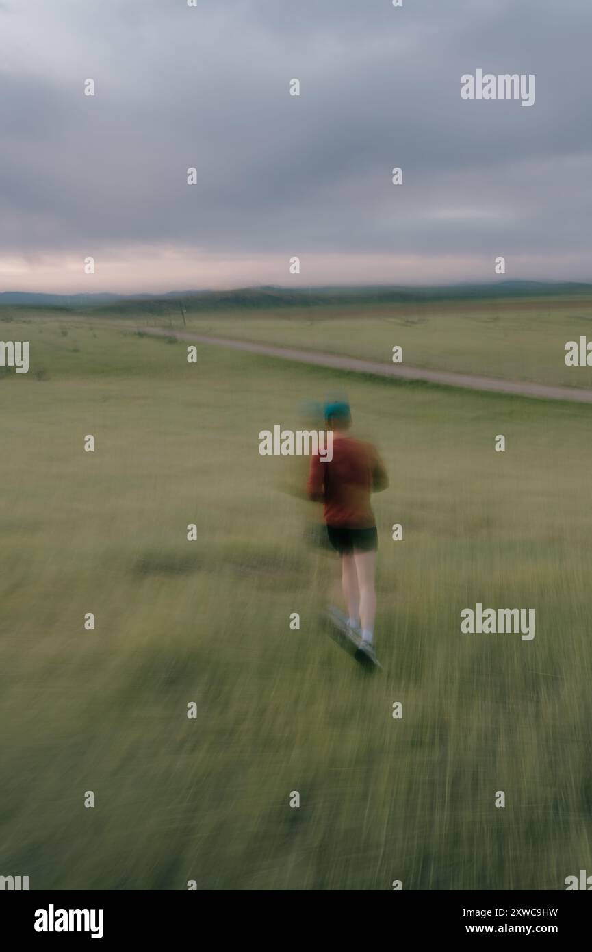 Blurred Runner in Quick Motion Stock Photo - Alamy