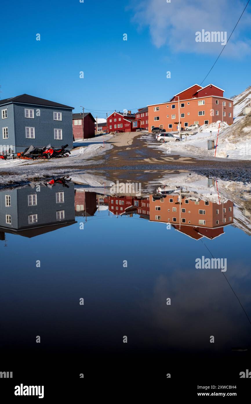 Colorful buildings reflected in pool of water Stock Photo - Alamy