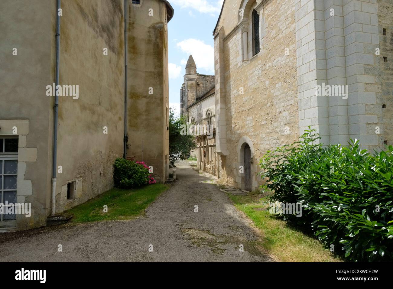 St Nicholas Church in Civray, France viewed from a passageway Stock ...