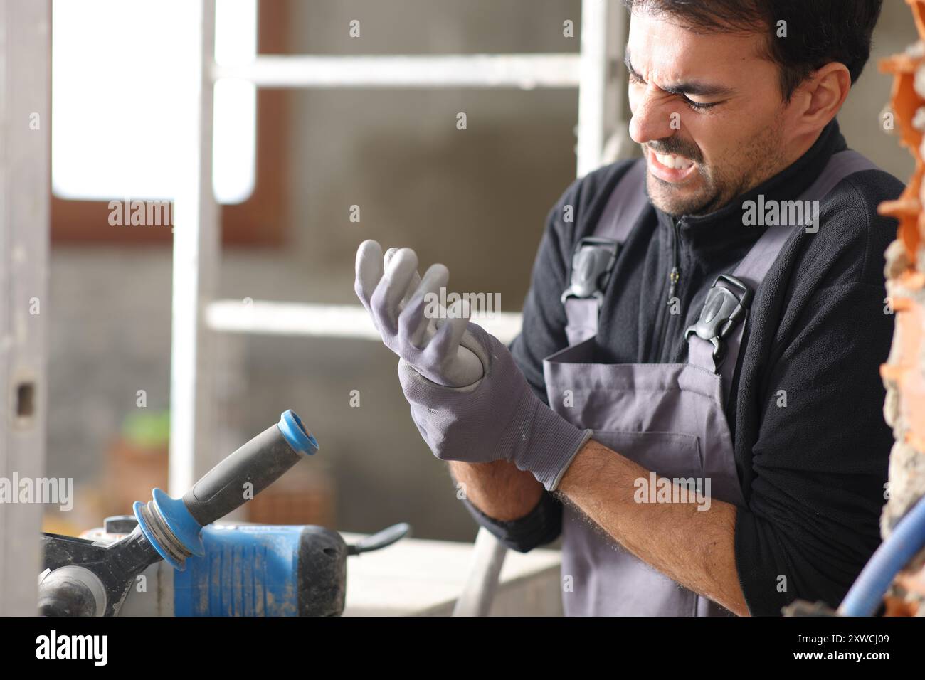 Construction worker suffering wrist ache after accident in a house ...