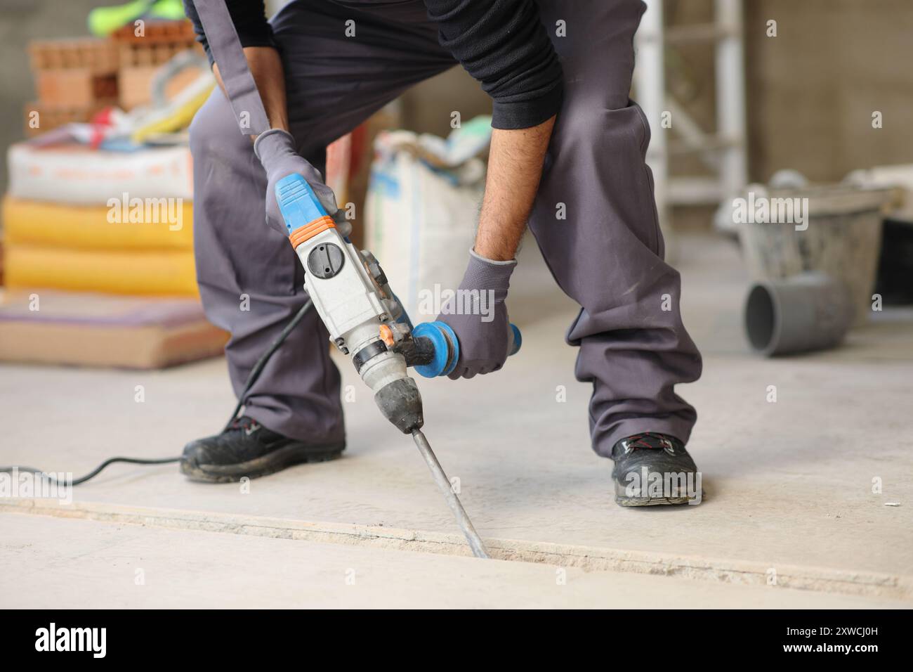 Worker using rotary hammer hi-res stock photography and images - Alamy