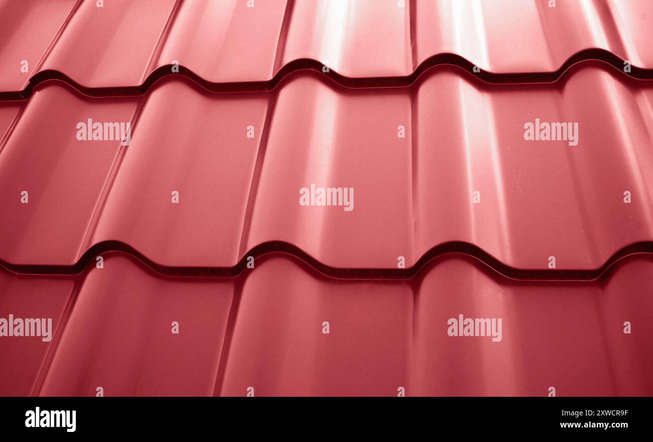 Close-up view lightweight steel roofing sheet. Red color coated modular ...