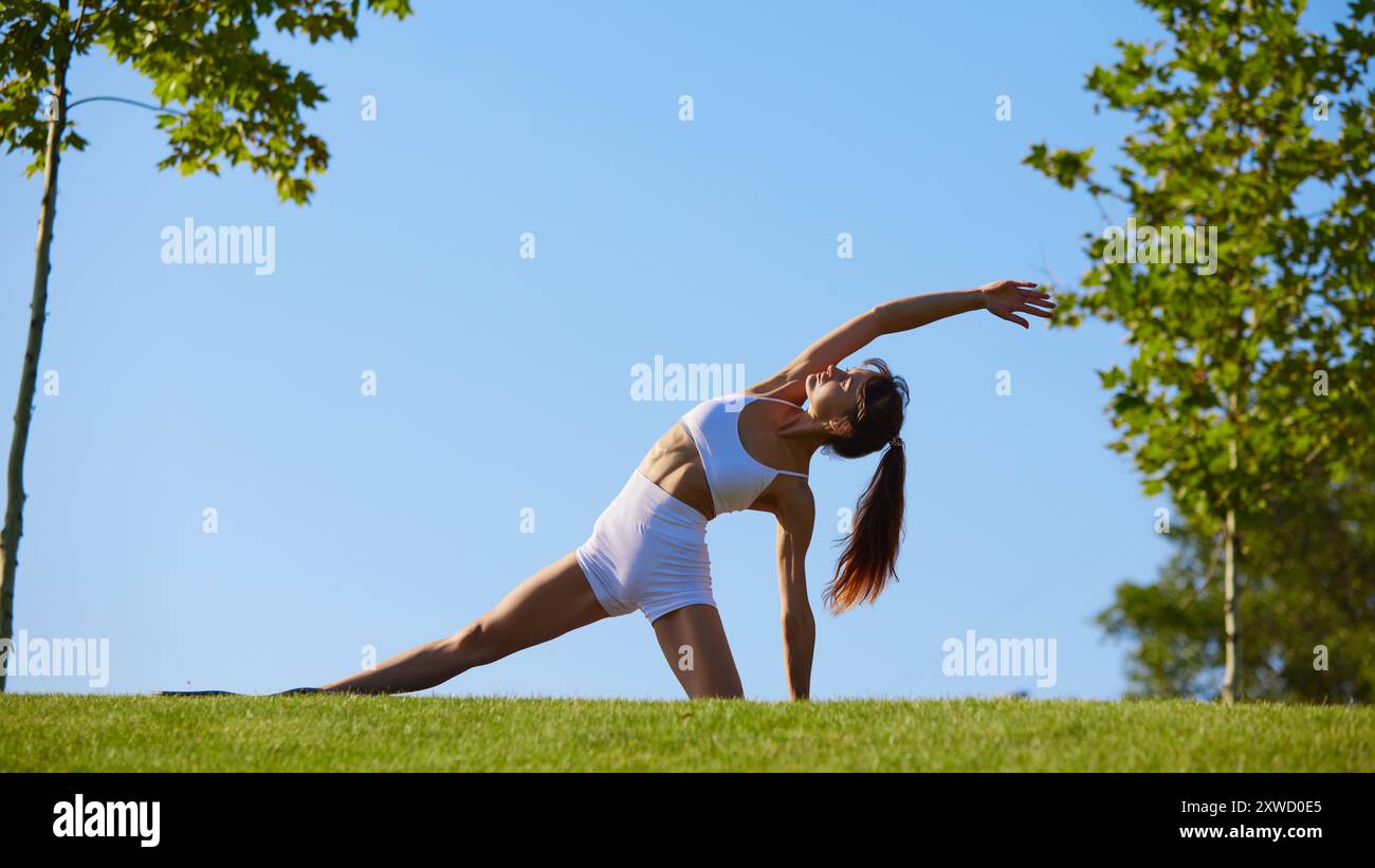 Embracing nature's calm, woman flows into side stretch, perfect blend ...