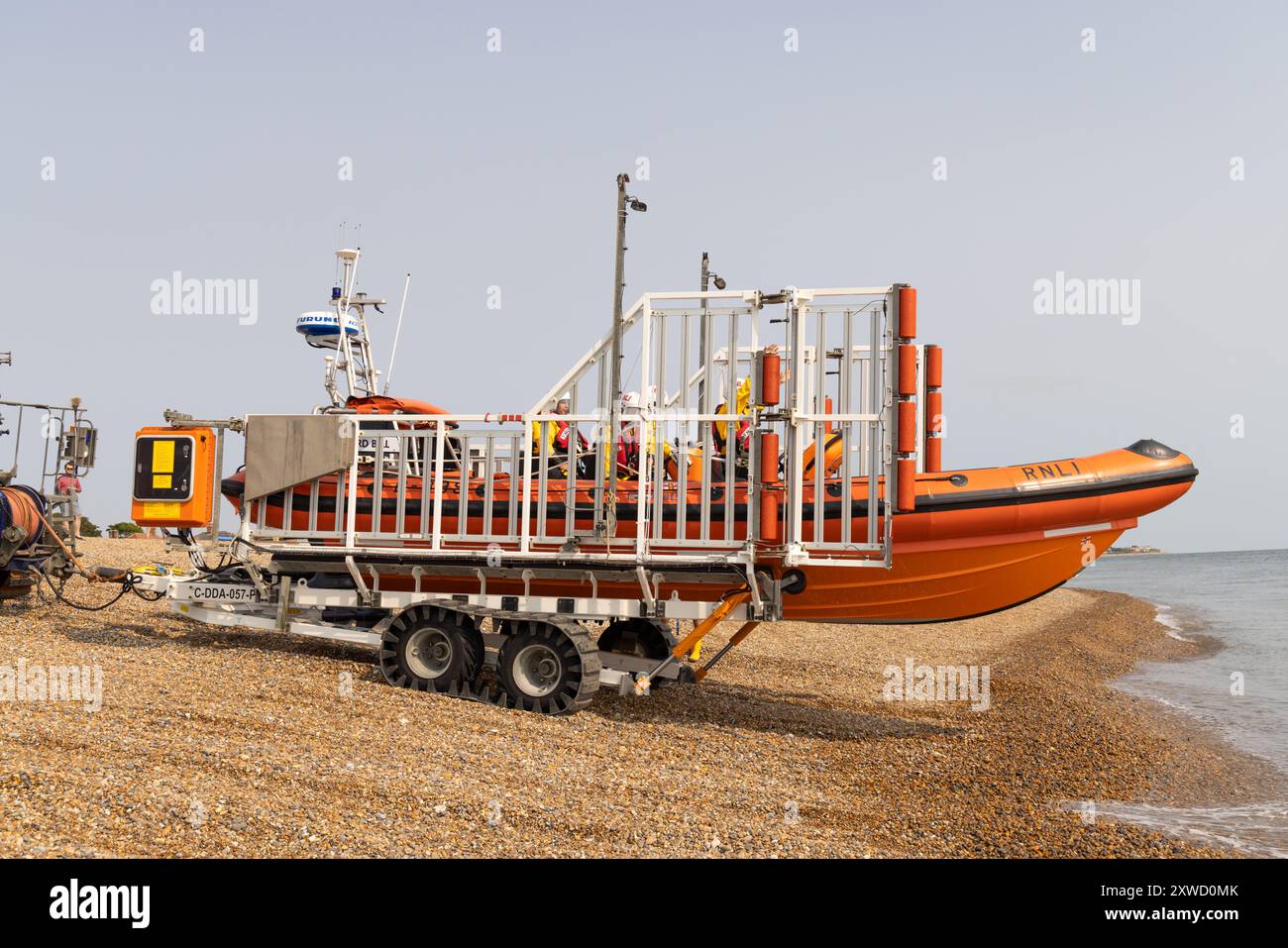 RNLI Atlantic 85 lifeboat being prepared for launch on the beach for a ...