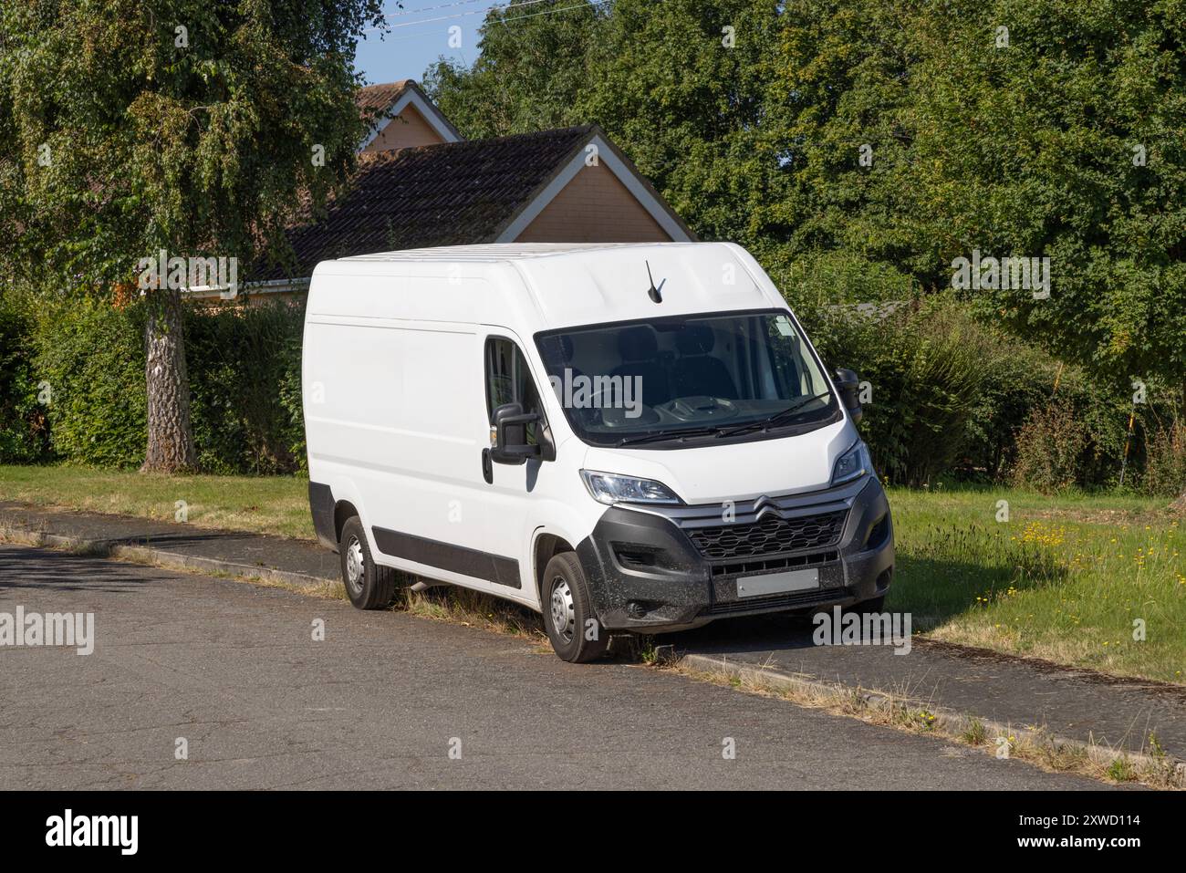 Van parked on a pavement obstructing it for pedestrians. Suffolk UK ...
