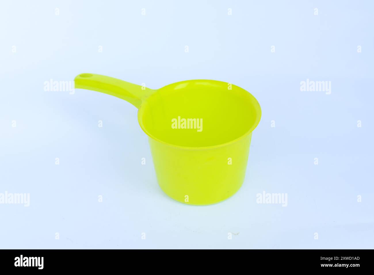 green water dipper for bathing Stock Photo - Alamy