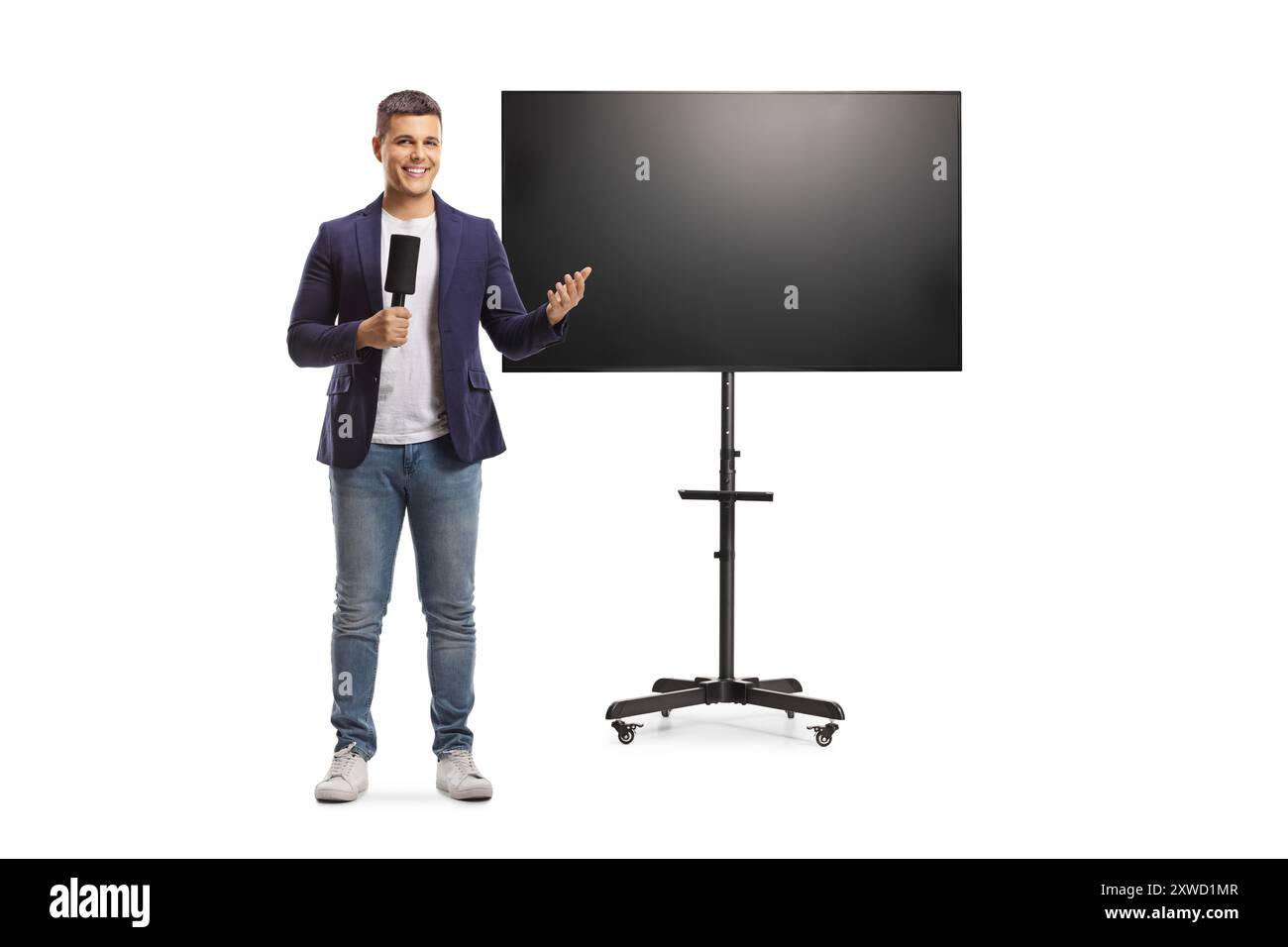 Full length portrait of male presenter holding a microphone and ...