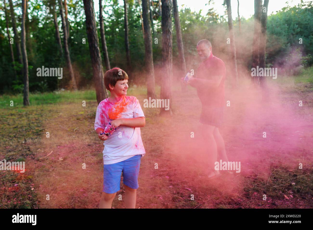 Father and son at Holi paint party. Family make funny party Stock Photo ...