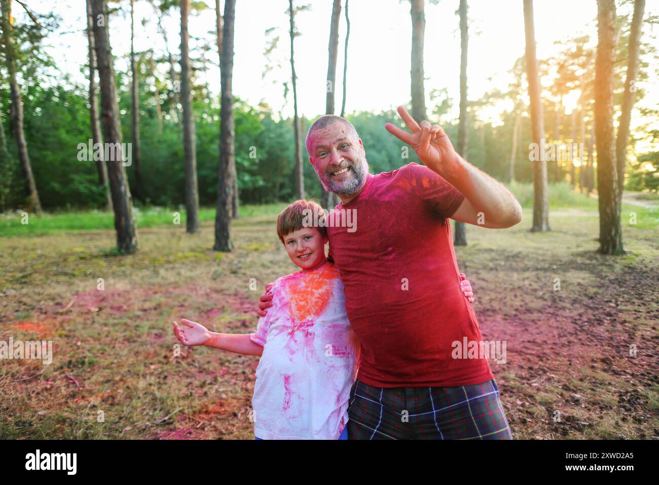Father and son at Holi paint party. Family make funny party Stock Photo ...