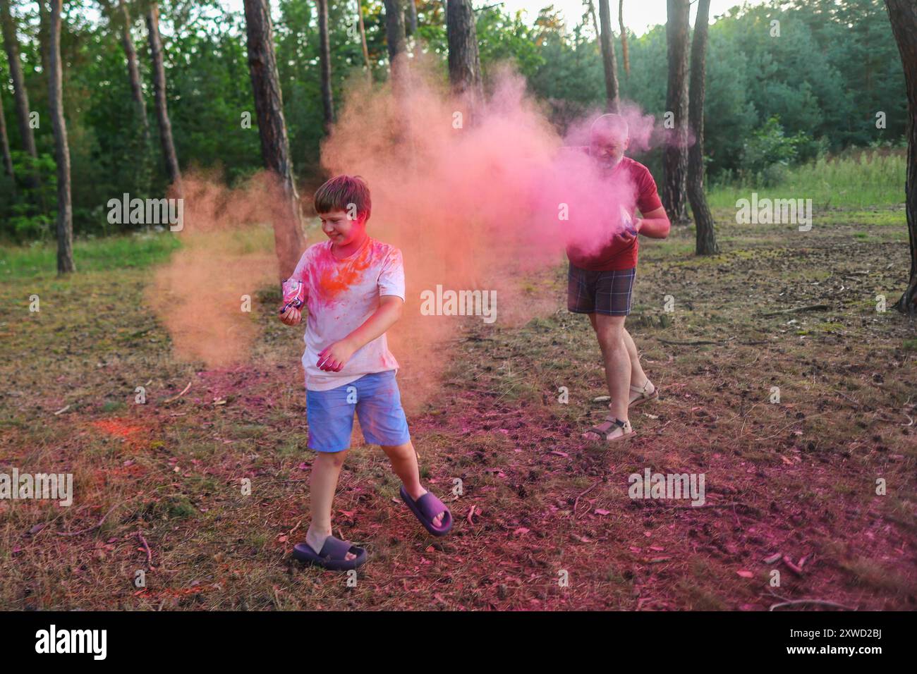 Father and son at Holi paint party. Family make funny party Stock Photo ...