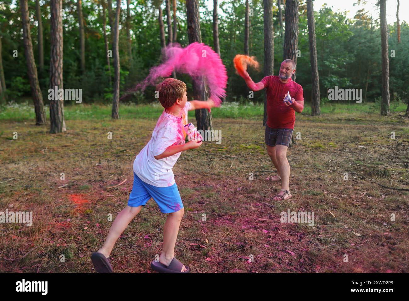 Father and son at Holi paint party. Family make funny party Stock Photo ...