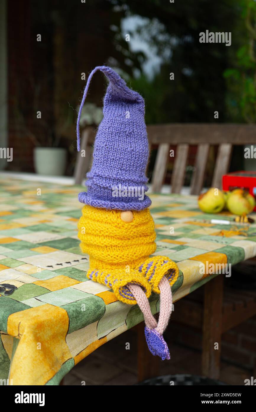 Blue and Yellow Summer Gnome sitting on a Table. Homemade knitted ...