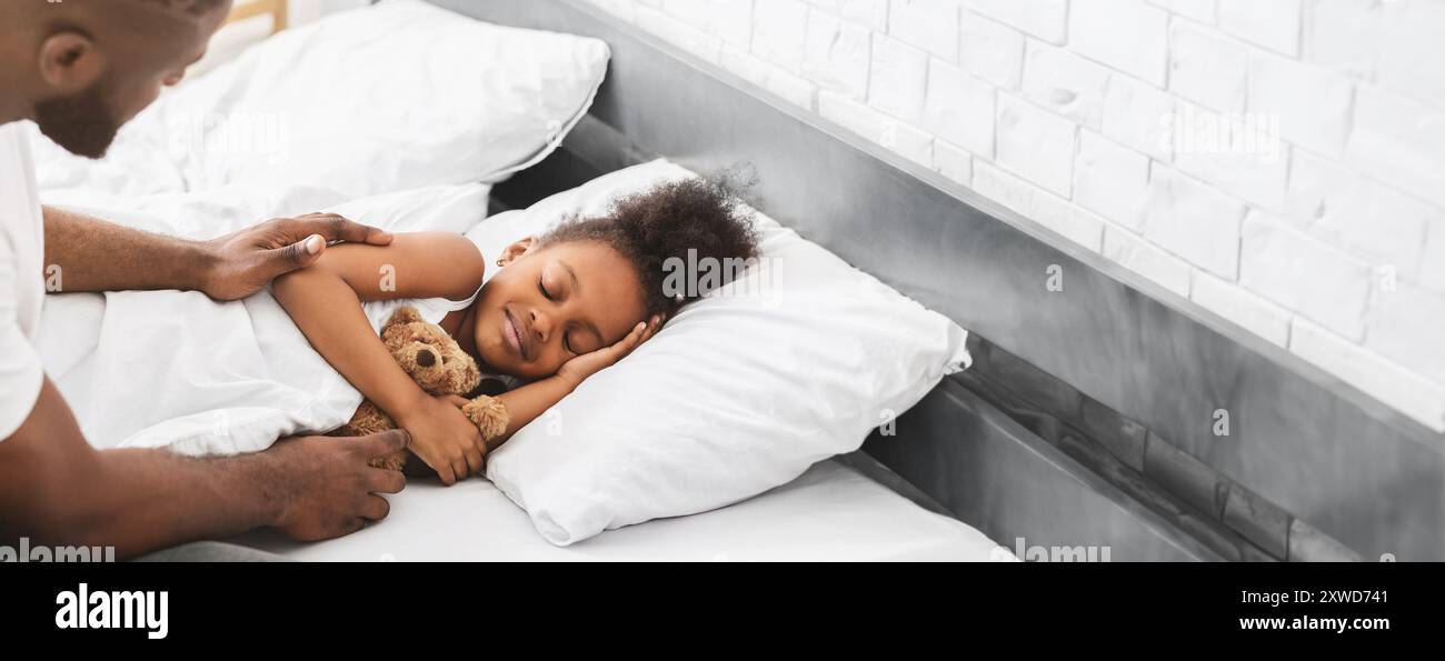 Tucking in child night hi-res stock photography and images - Alamy