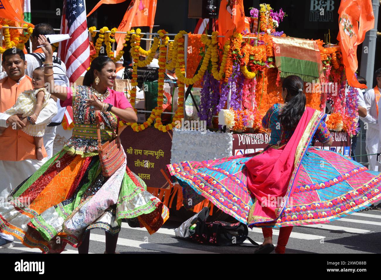 Women in traditional dress marching and dancing in the annual India Day ...