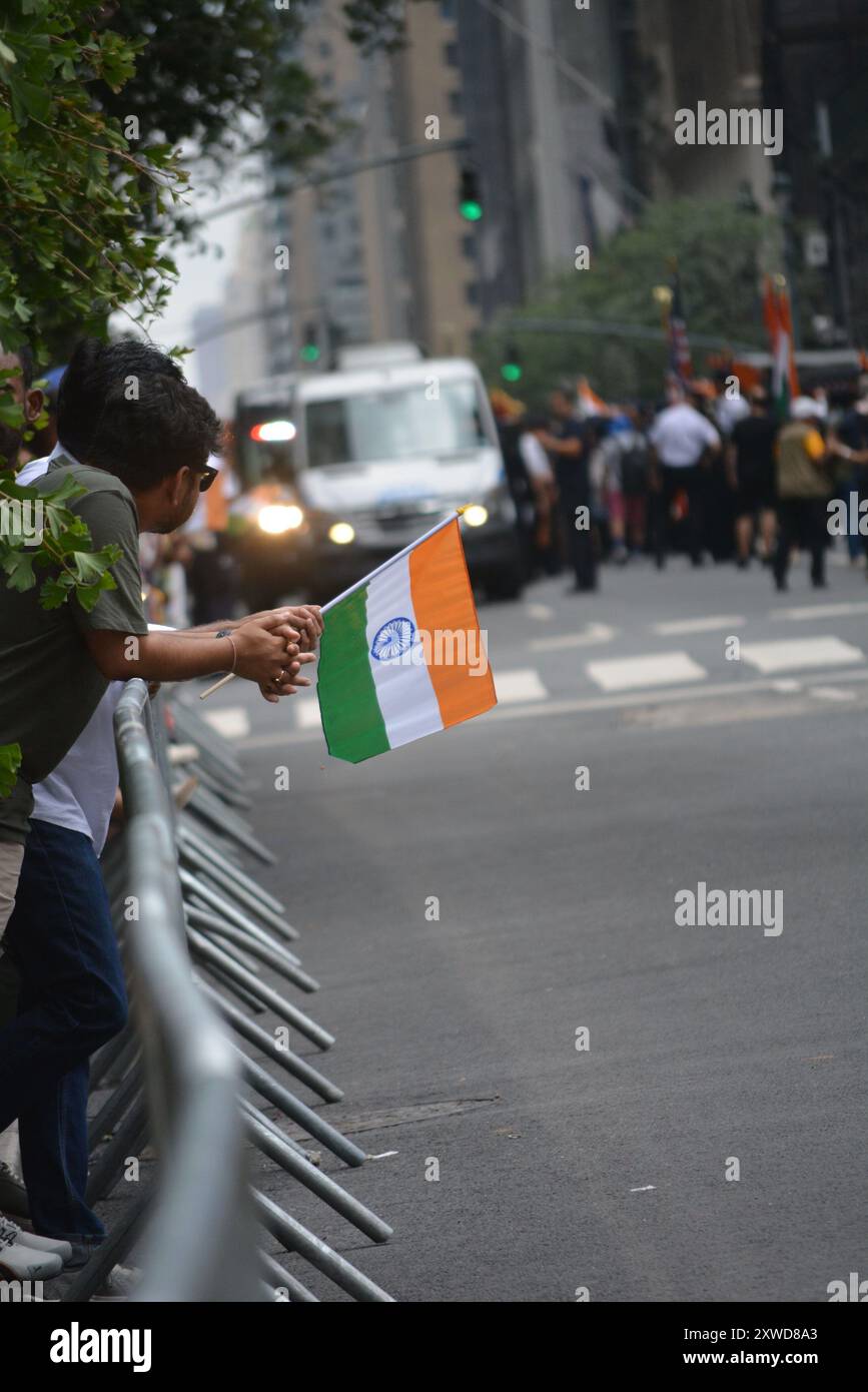 Spectator with an Indian flag waiting for the start of the annual India ...