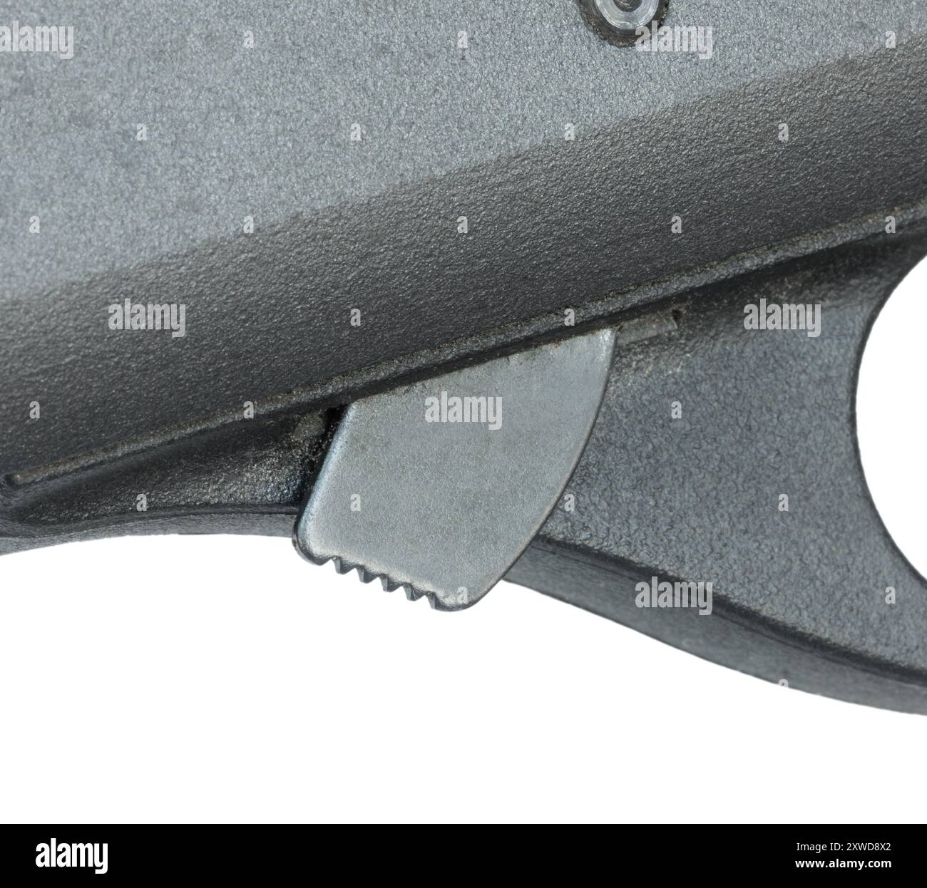 Isolated slide release lever on a pump action shotgun with black ...