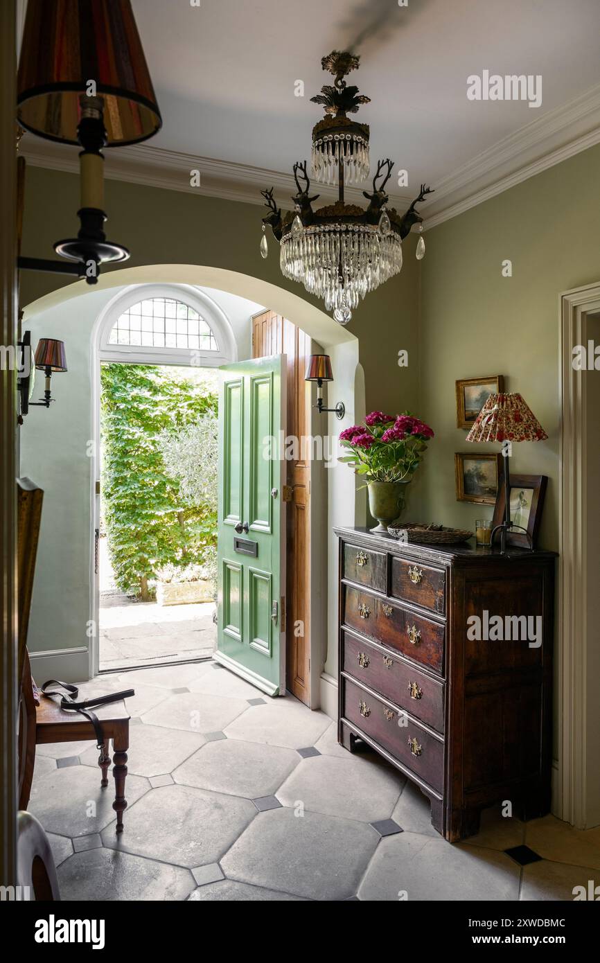 'Ball green' hall with limestone tiles in Wimbledon home, south-west ...