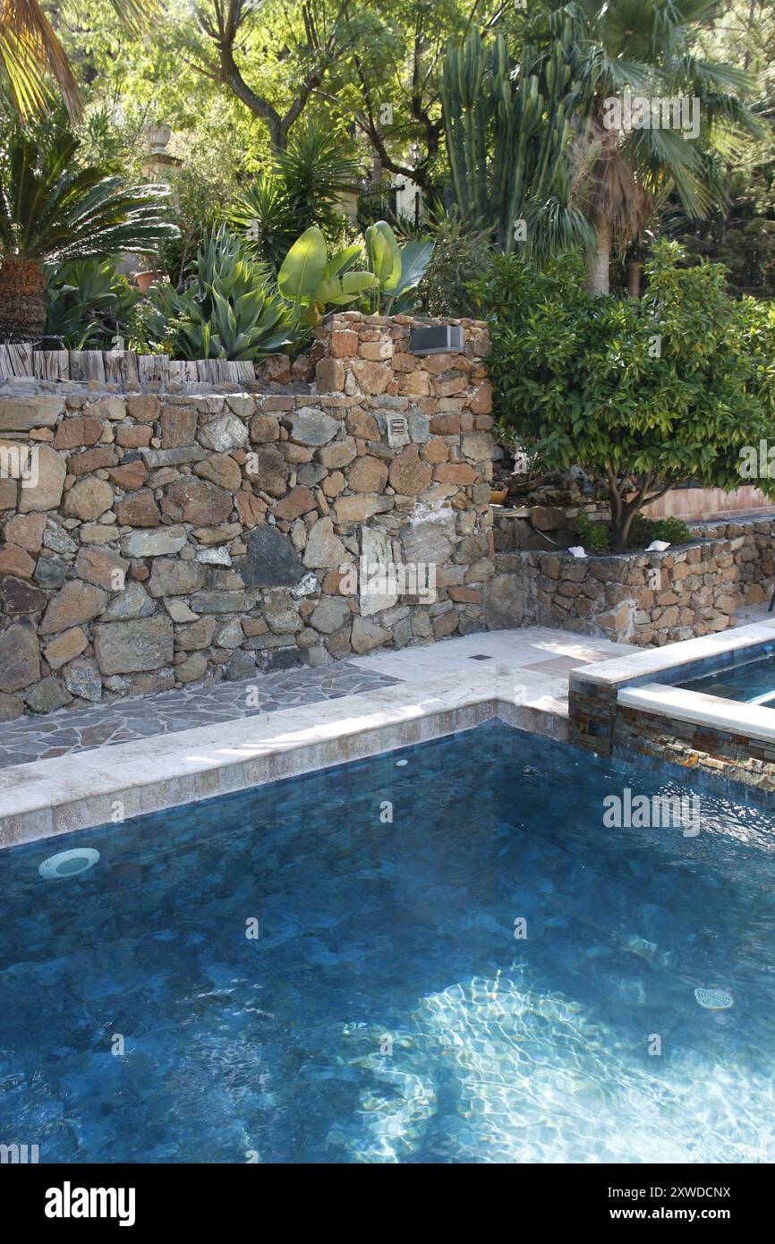 Lush green poolside garden in Andalusia, Spain Stock Photo - Alamy