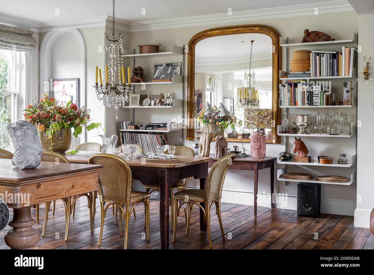 Dining table with gilt mirror and shelving in Wimbledon home, south ...