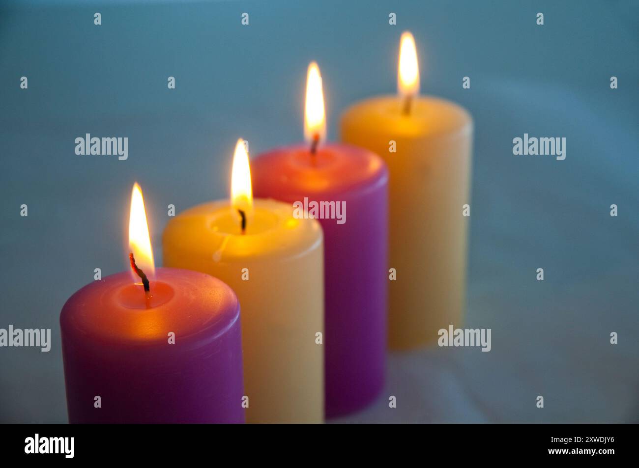 Four lit candles hi-res stock photography and images - Alamy