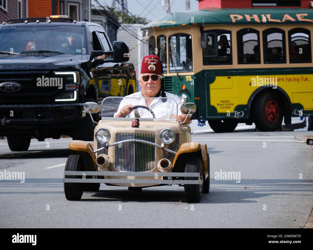 Shriners riding miniature vintage car, Natal Day Parade, Halifax Stock ...