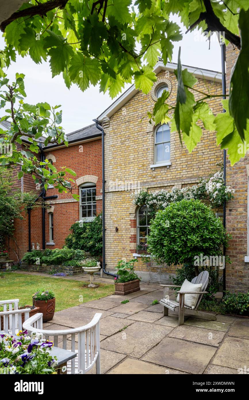 Paved exterior terrace of Wimbledon home, south-west London, England ...