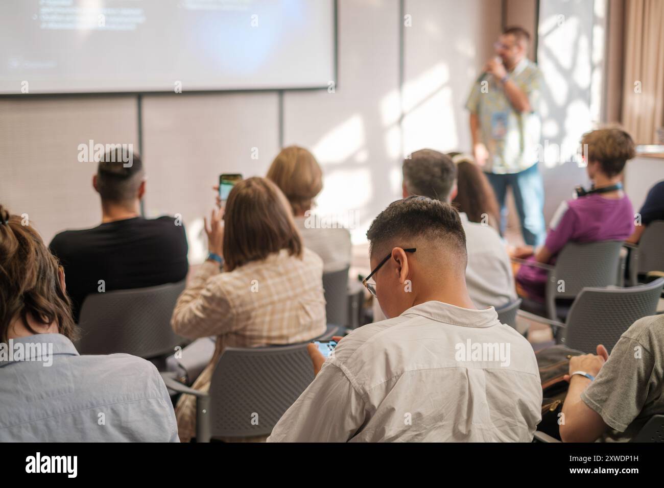 Group of people attending business conference meeting. Audience ...