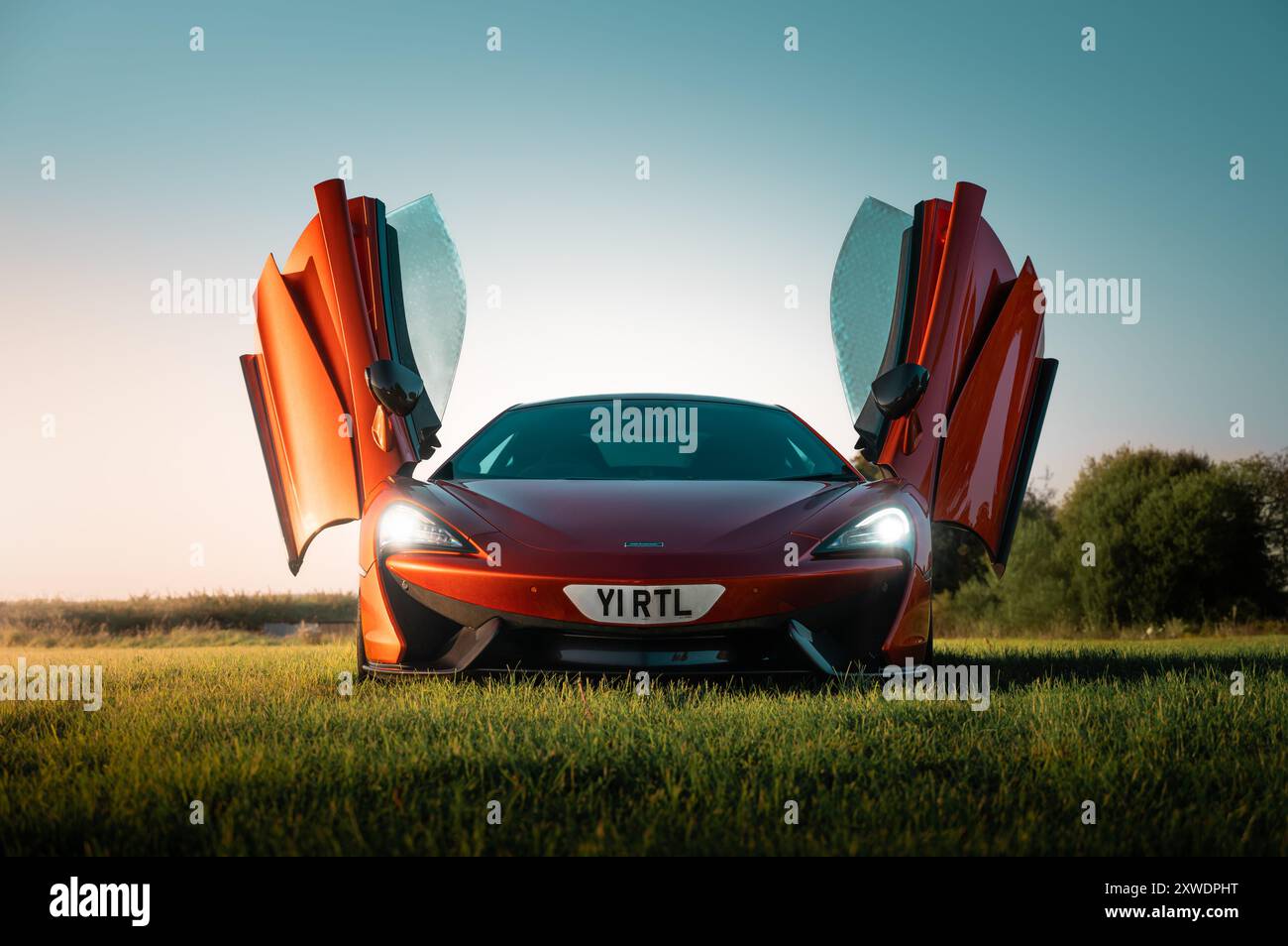 McLaren 570 GT - Volcano Orange Stock Photo - Alamy