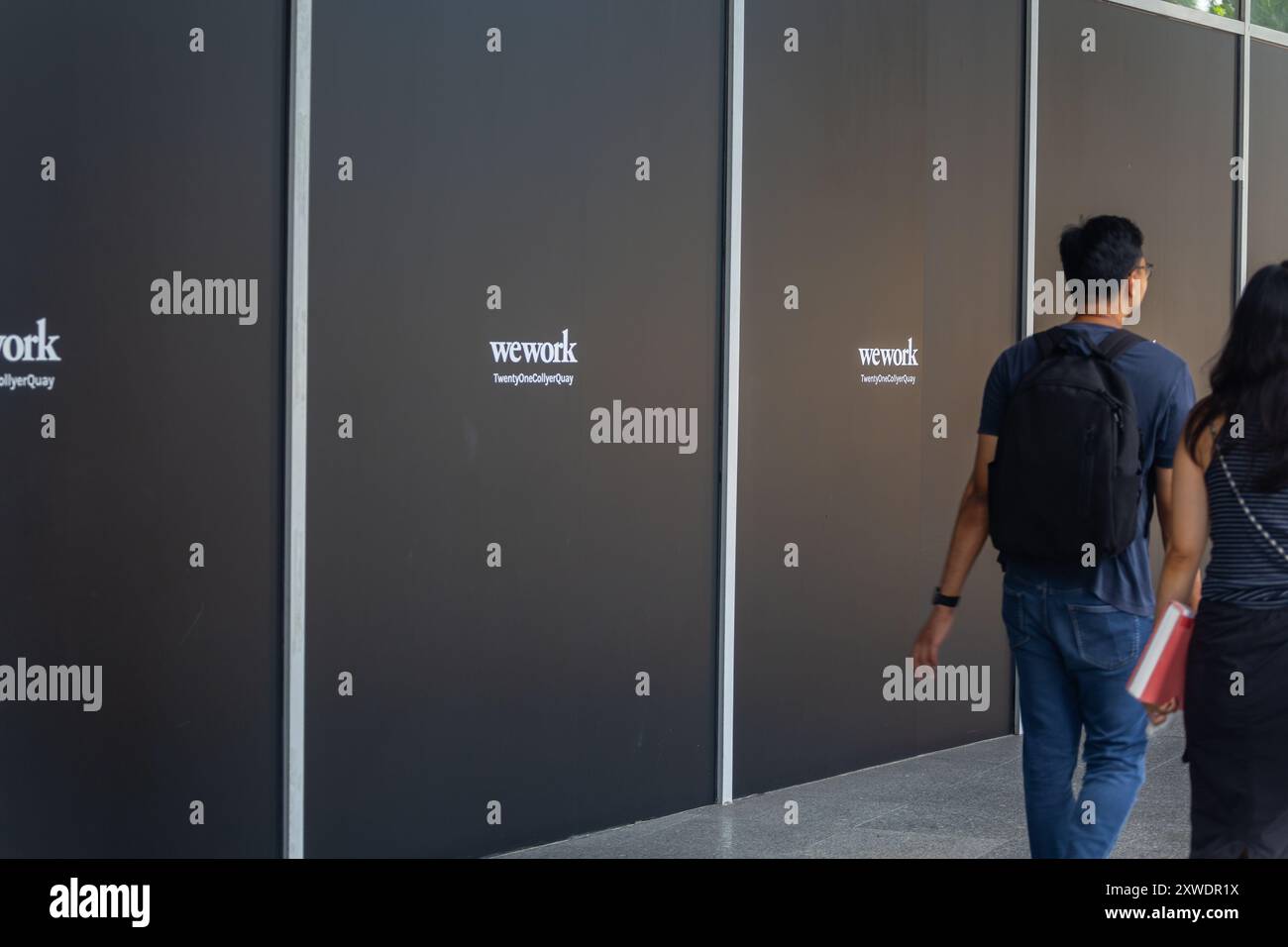 19 Aug 2024. People walking pass Wework on the street. A company that ...