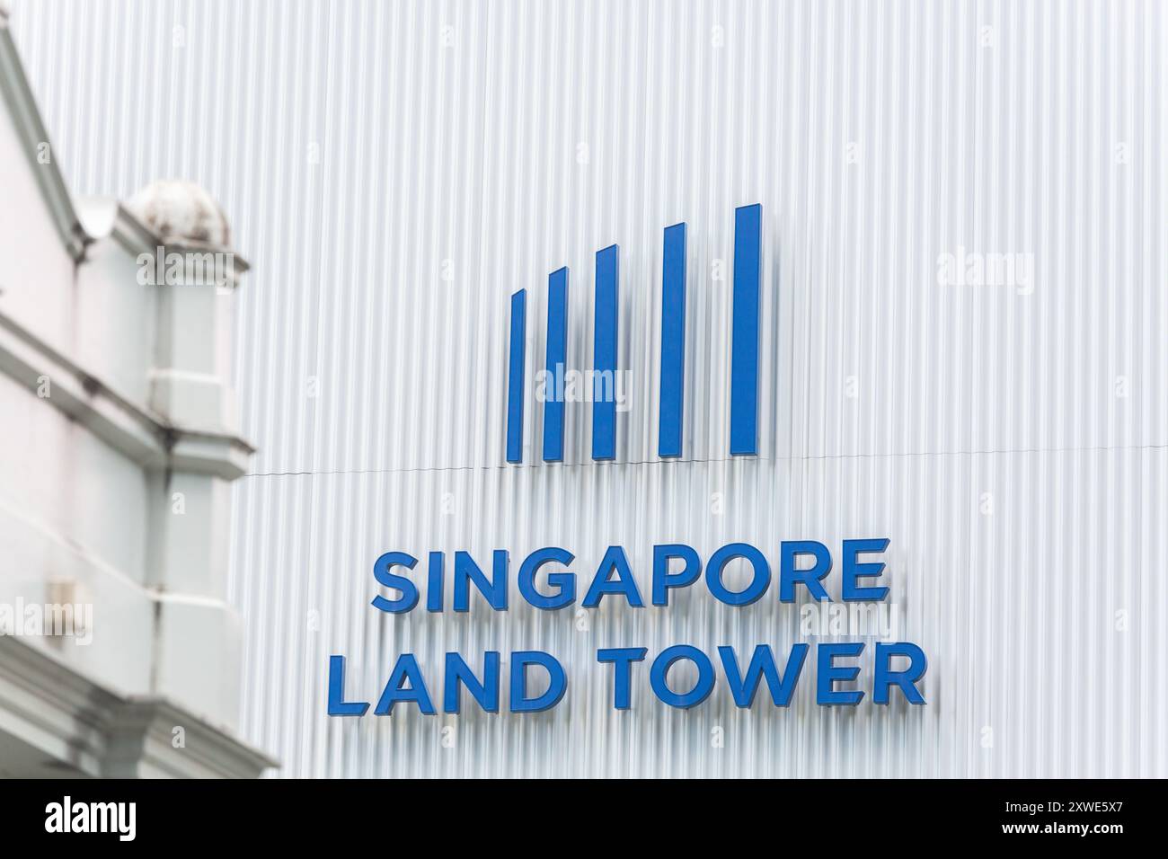 19 Aug 2024. Singapore Land Tower blue logo and signage against a white ...
