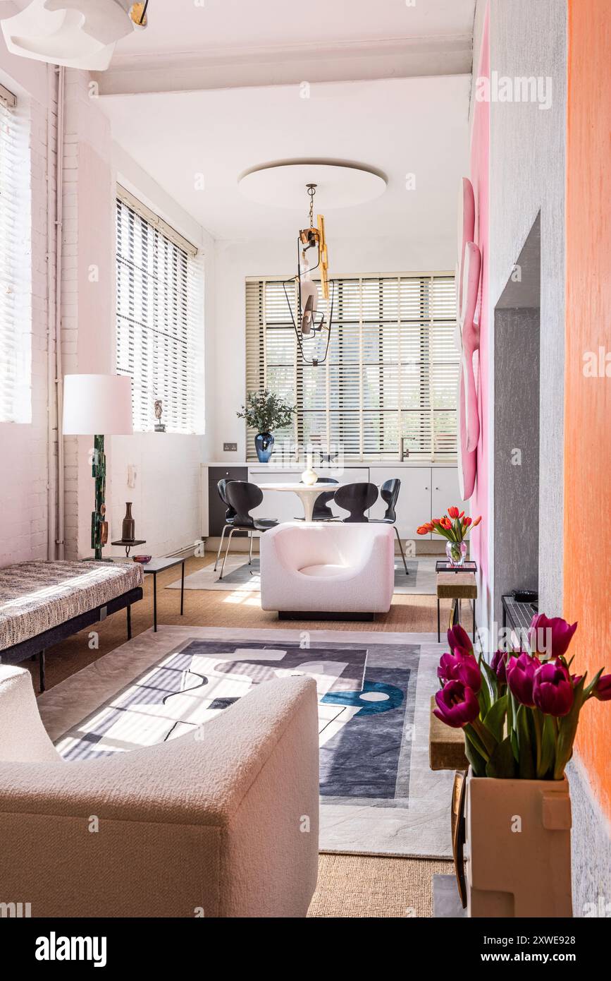 Open plan living room in modern studio apartment of British designer ...