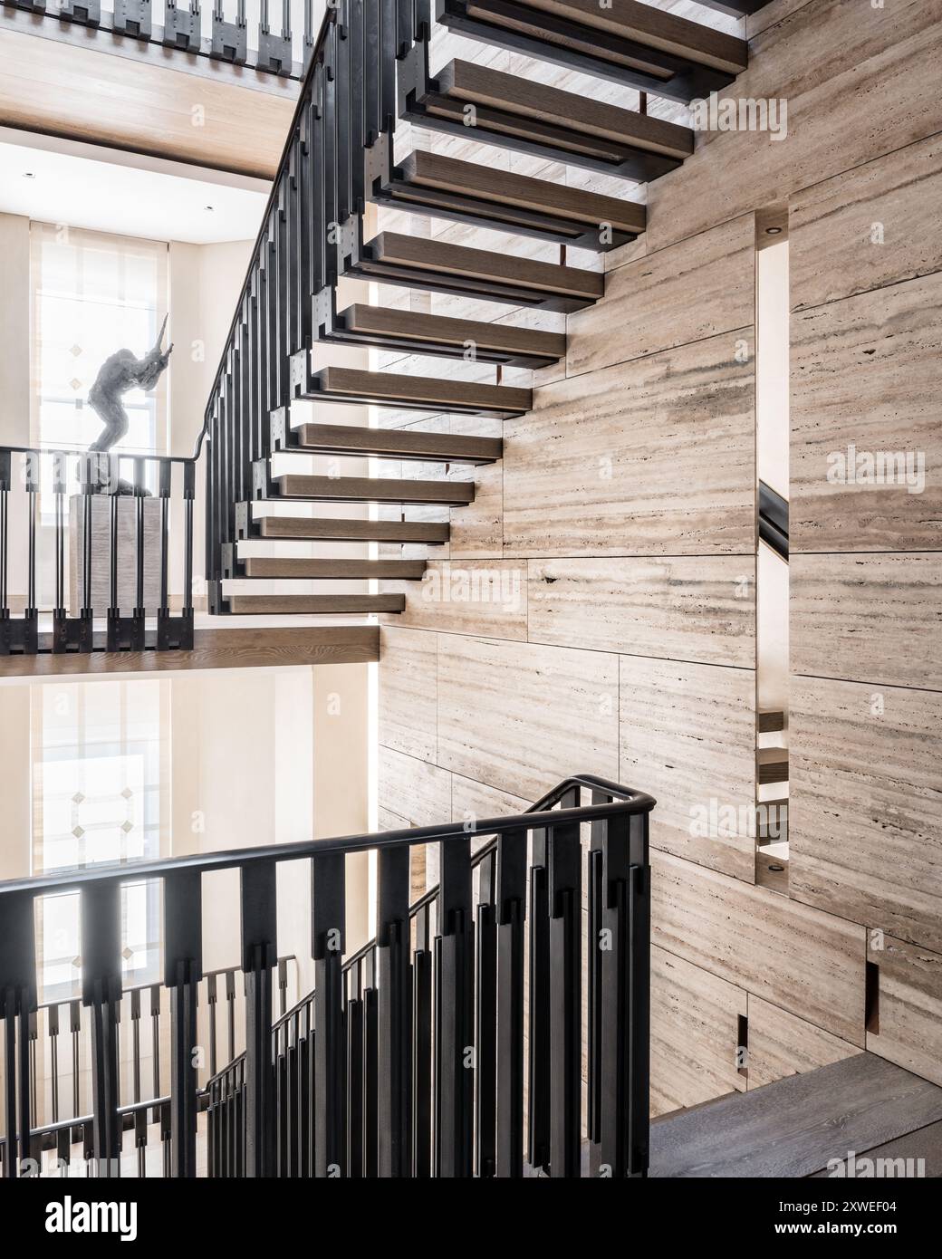 Open tread travertine staircase in luxury modern British home in London ...