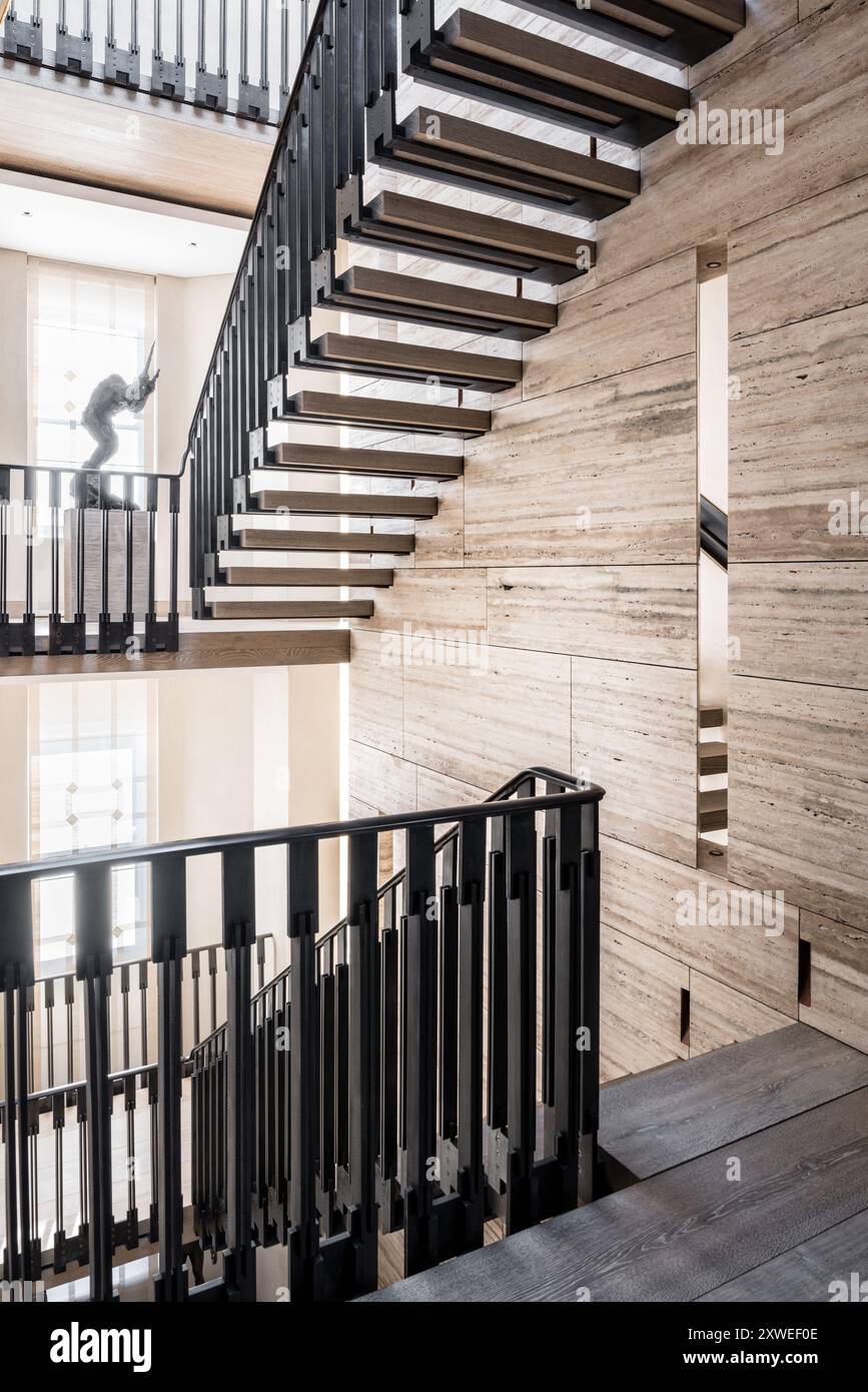Open tread travertine staircase in luxury modern British home in London ...