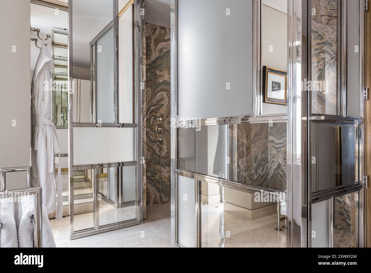 Open door to en suite shower cubicle in luxury modern British home in ...