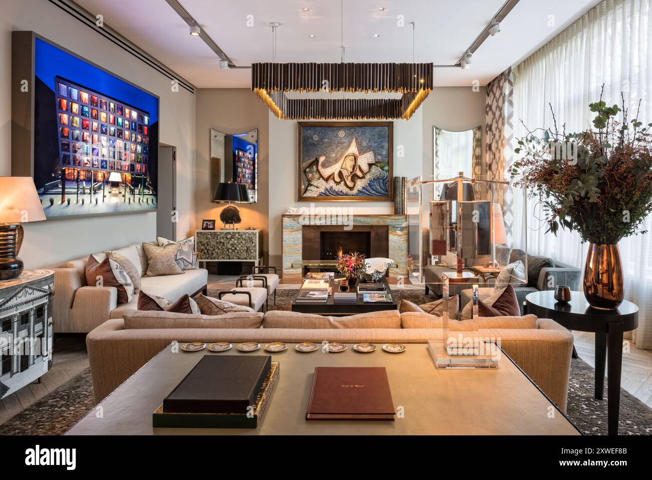 Modern art in drawing room of luxury modern British home in London, UK ...