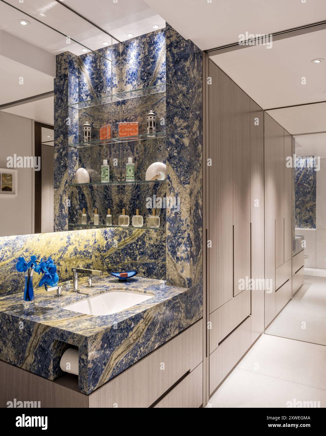 Marble sink and mirrored wall in bathroom of luxury modern British home ...
