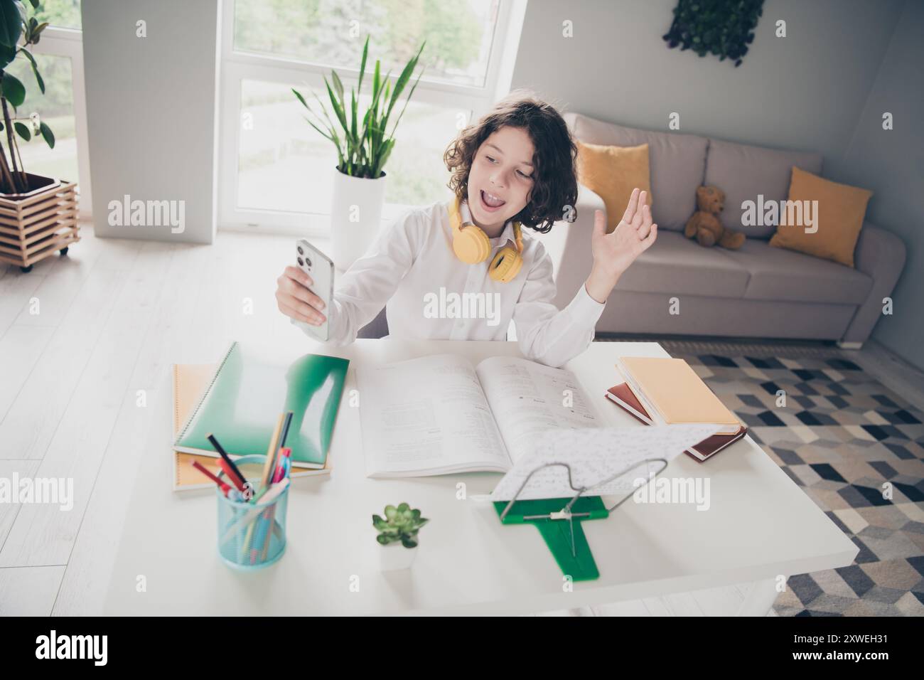 Photo of charming cheerful little boy schoolkid wearing white shirt ...