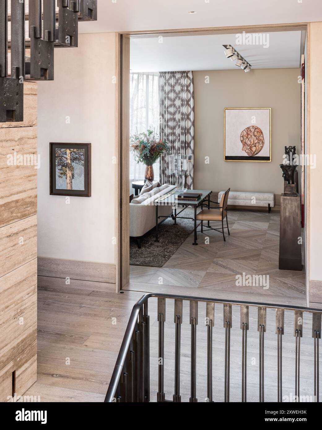 View through open doorway to desk and chair from landing in luxury ...