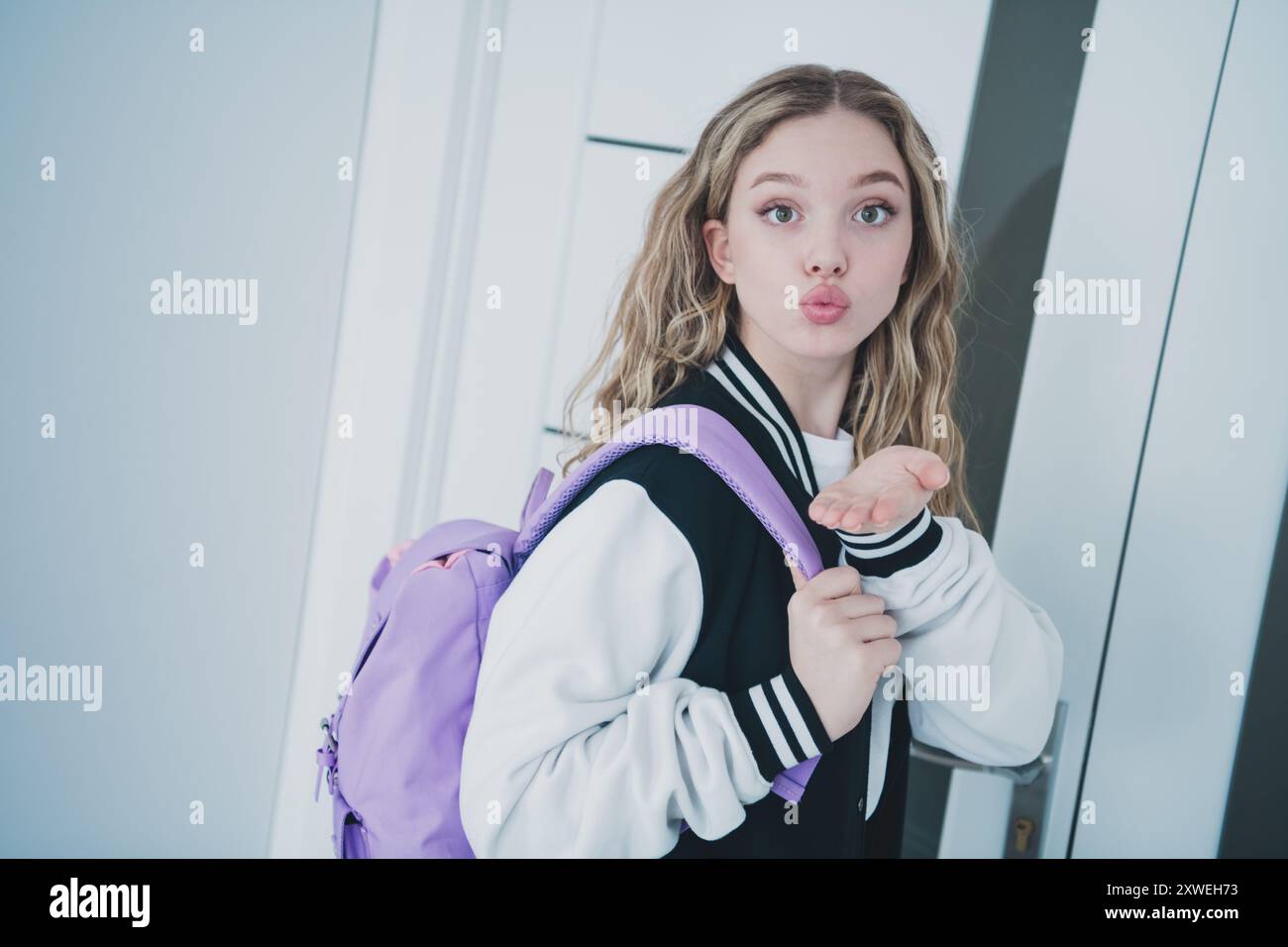 Photo of sweet pretty teen girl send you air kiss bye wear stylish ...