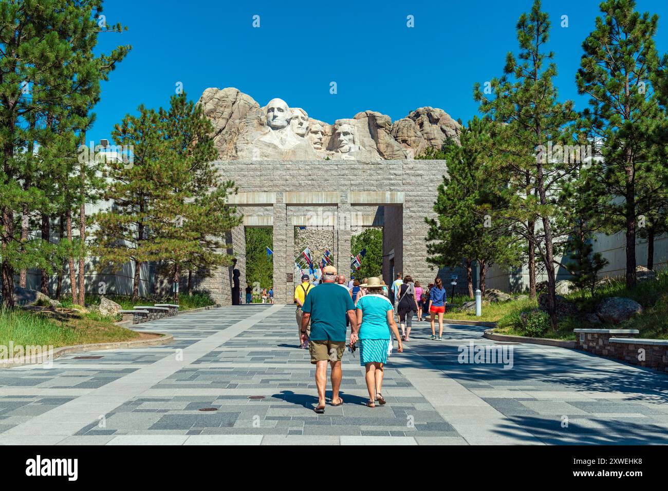 Tourists walking to the entrance of Mount Rushmore national monument ...