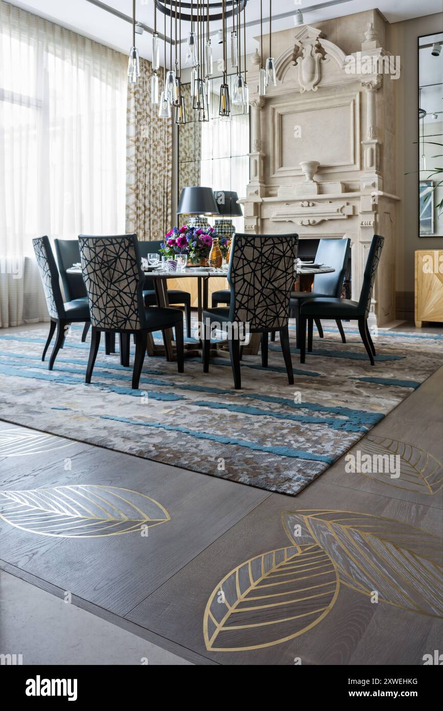Dining room with inlaid leaf motif on floor in luxury modern British ...