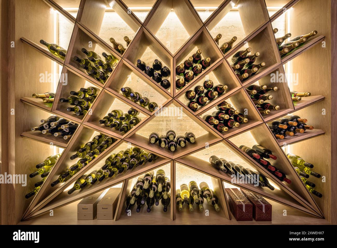 Wine cellar bottle shelves in luxury modern British home. London, UK ...