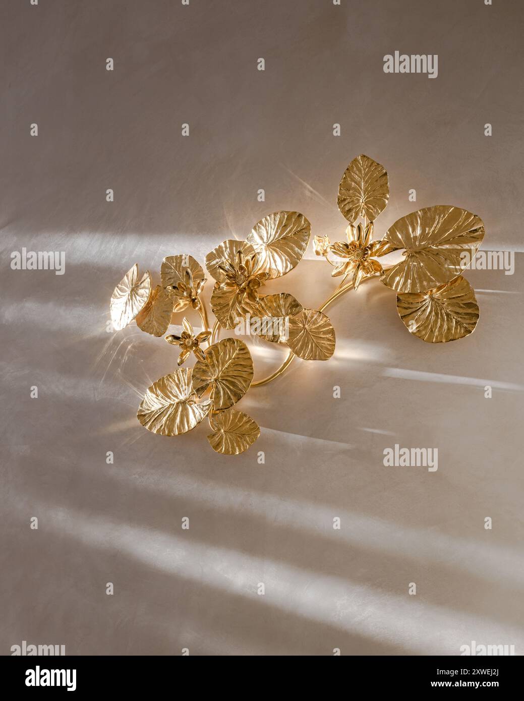 Gilt monstera leaf light fitting in luxury modern British home. London ...