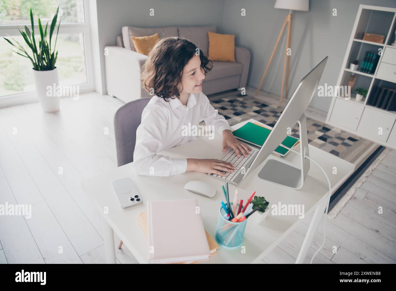 Photo of charming clever little boy schoolkid wearing white shirt ...