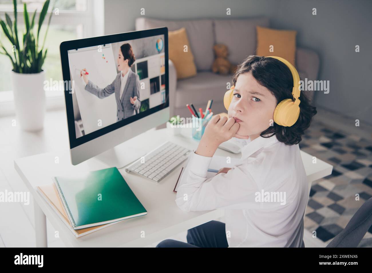 Photo of clever smart diligent little boy schoolkid sitting desk ...