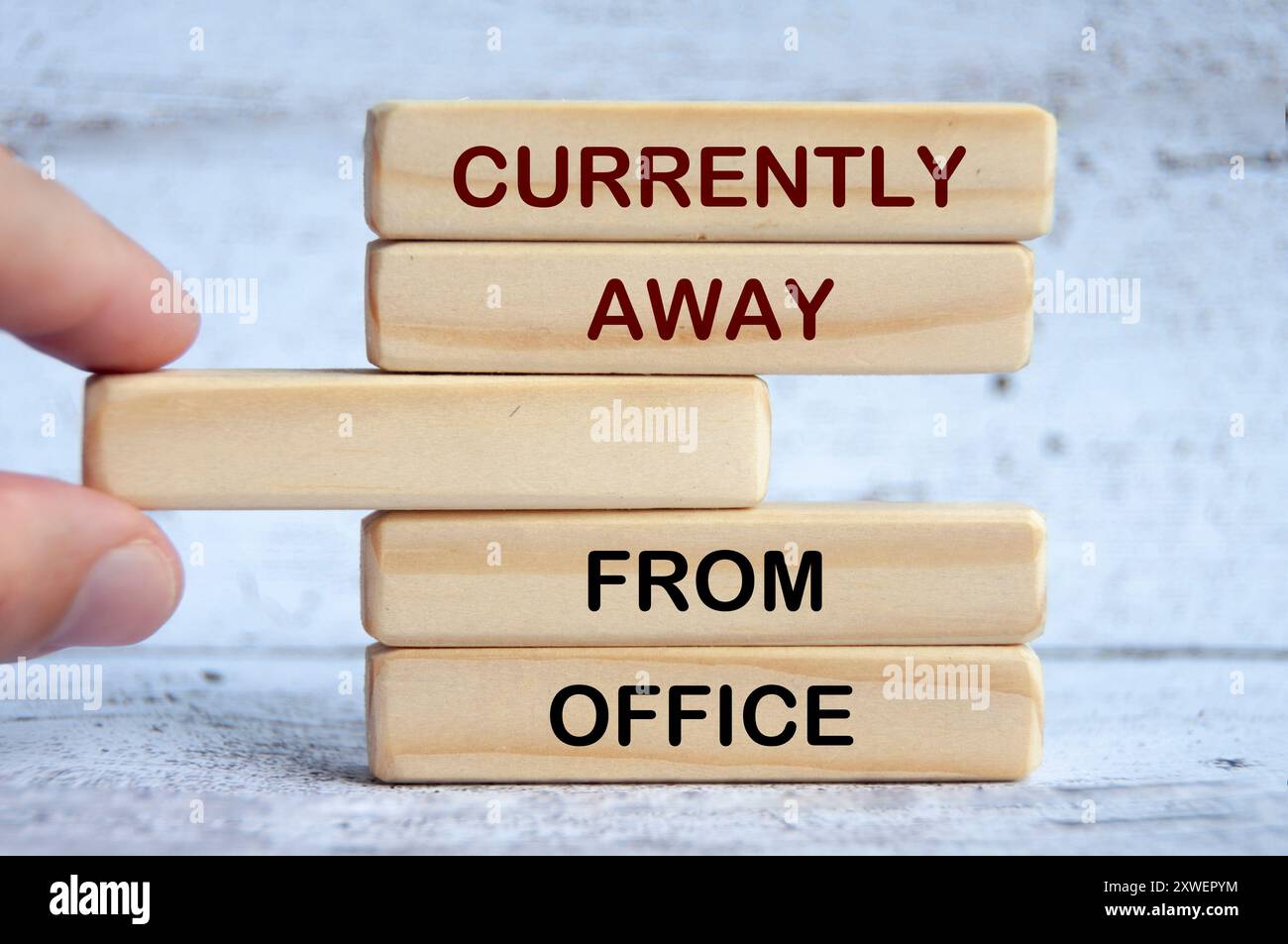 Currently away from office text on wooden blocks. Out of office concept ...