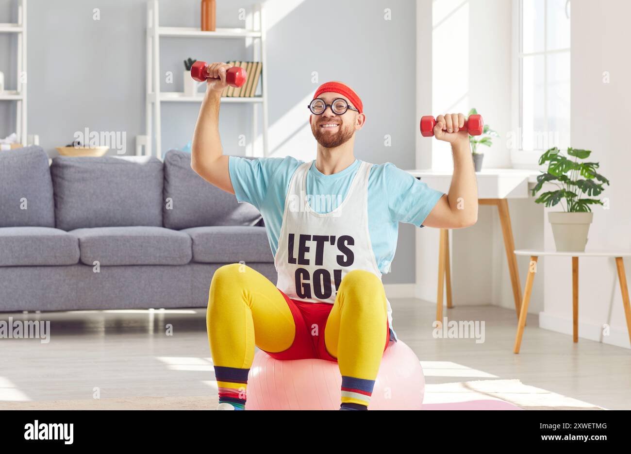 Funny sportsman, comic bodybuilder holding dumbbell weights to exercise ...