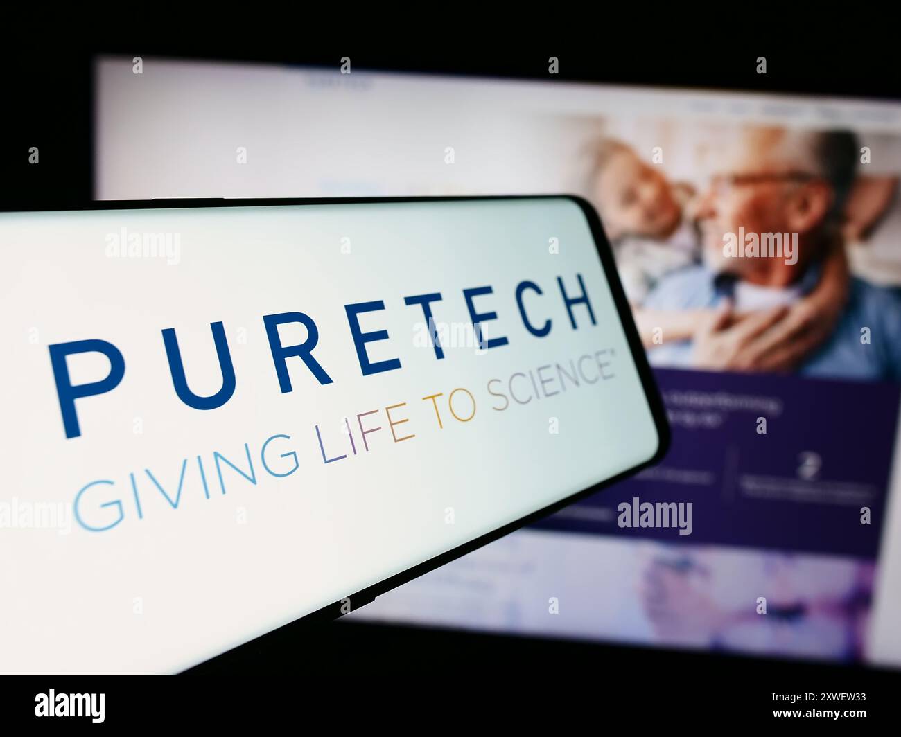 Cellphone with logo of biotechnology company PureTech Health plc in ...