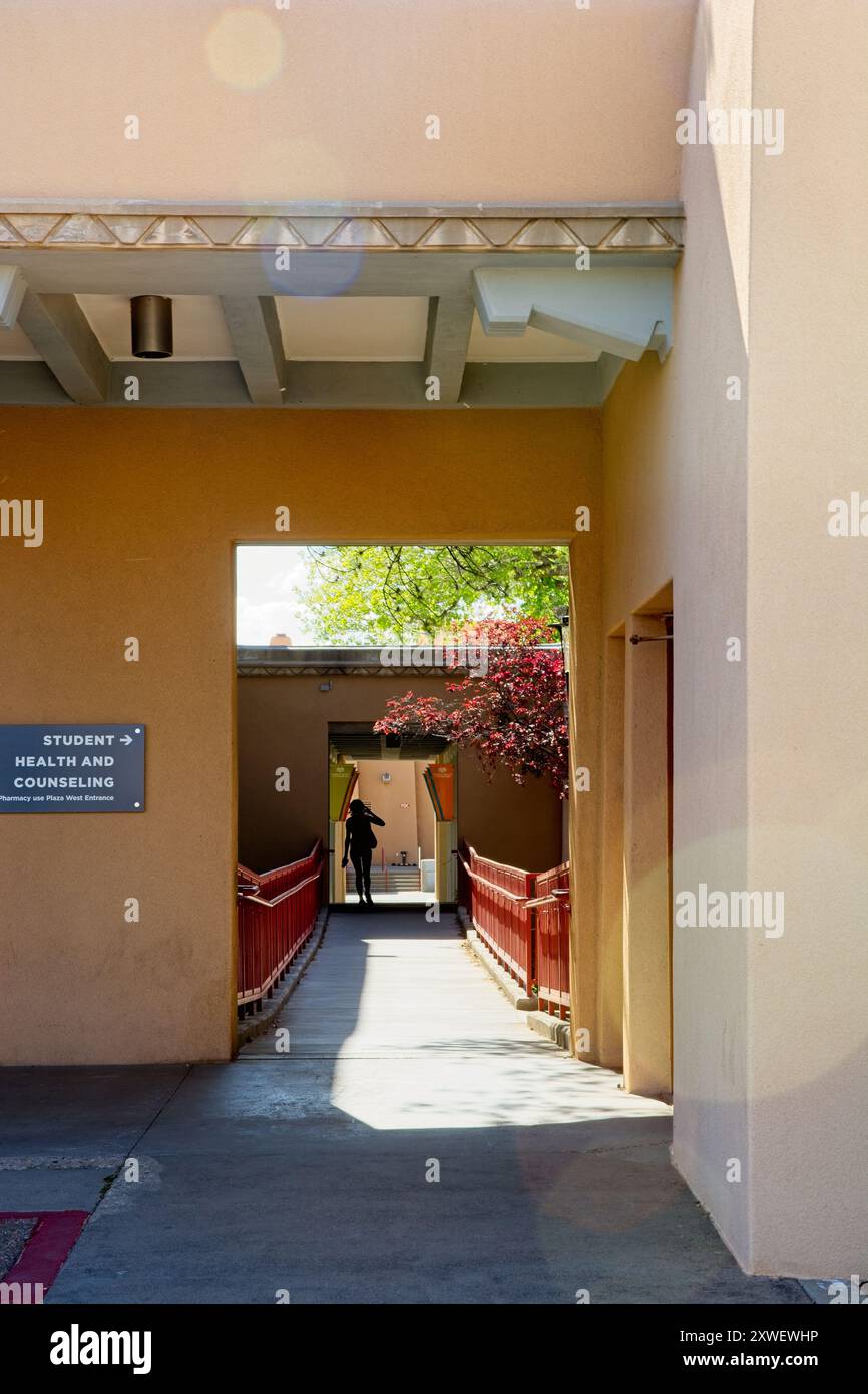 Student following walkway through building courtyard to campus student ...