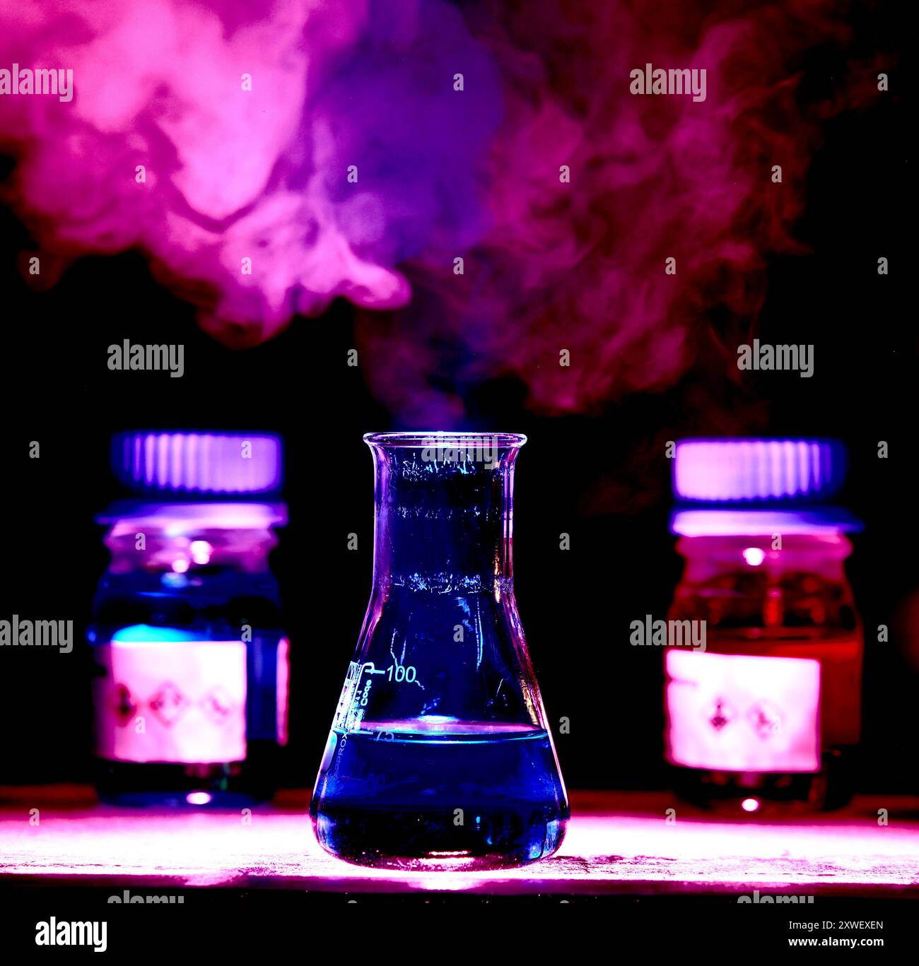 A laboratory scene with colorful chemical reactions in flasks and ...